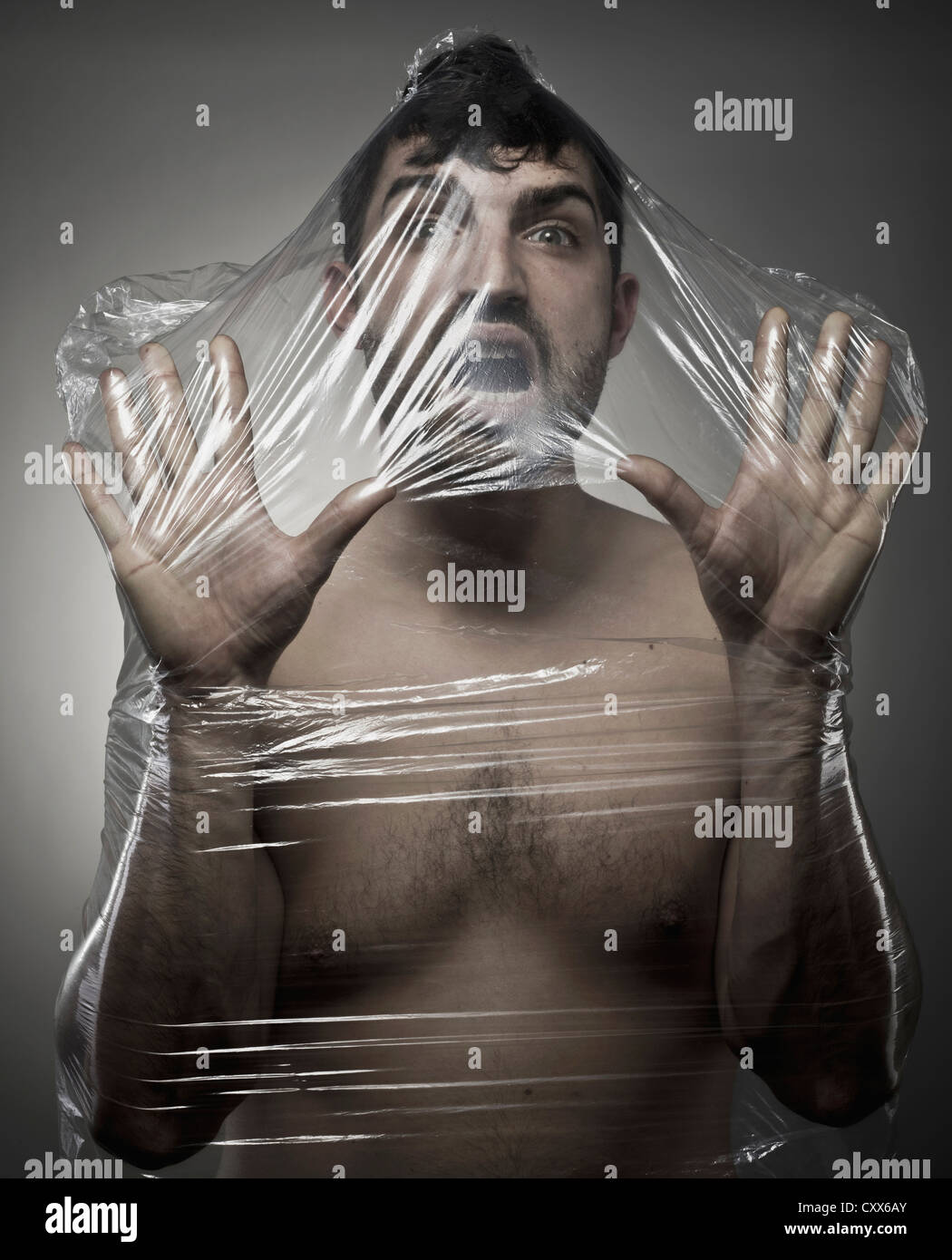 Man wrapped in plastic Stock Photo - Alamy