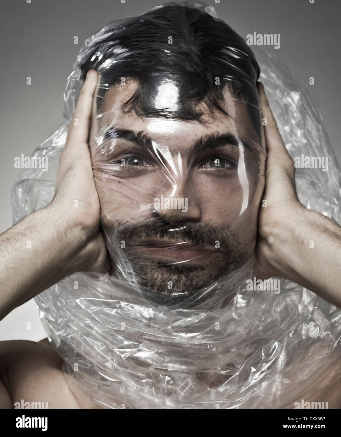 Man wrapped in plastic Stock Photo - Alamy
