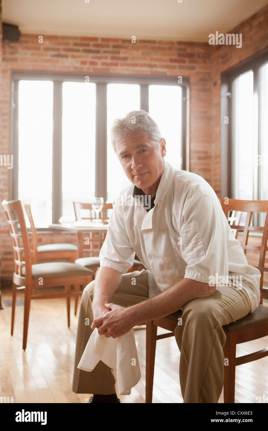 Caucasian chef sitting in restaurant Stock Photo - Alamy