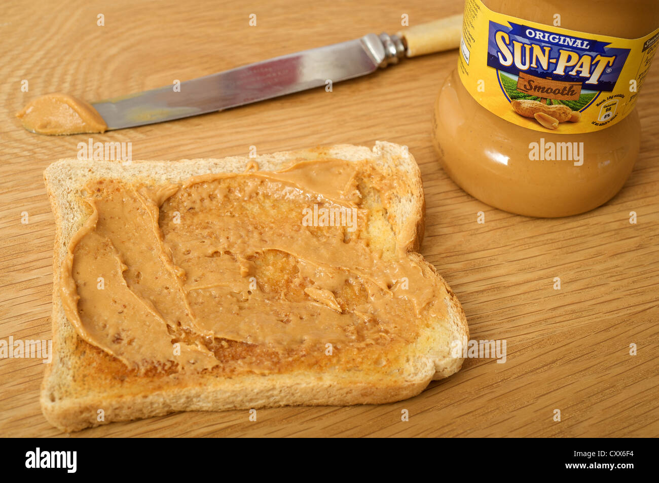 Sun-Pat smooth peanut butter on toast Stock Photo - Alamy
