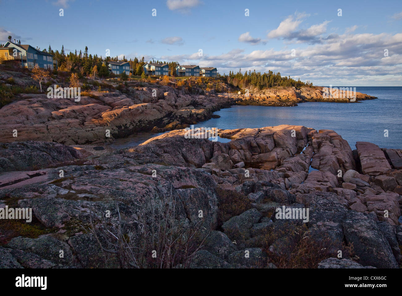 The sun sets on the rocky seashore and the intertidal zone of the St ...