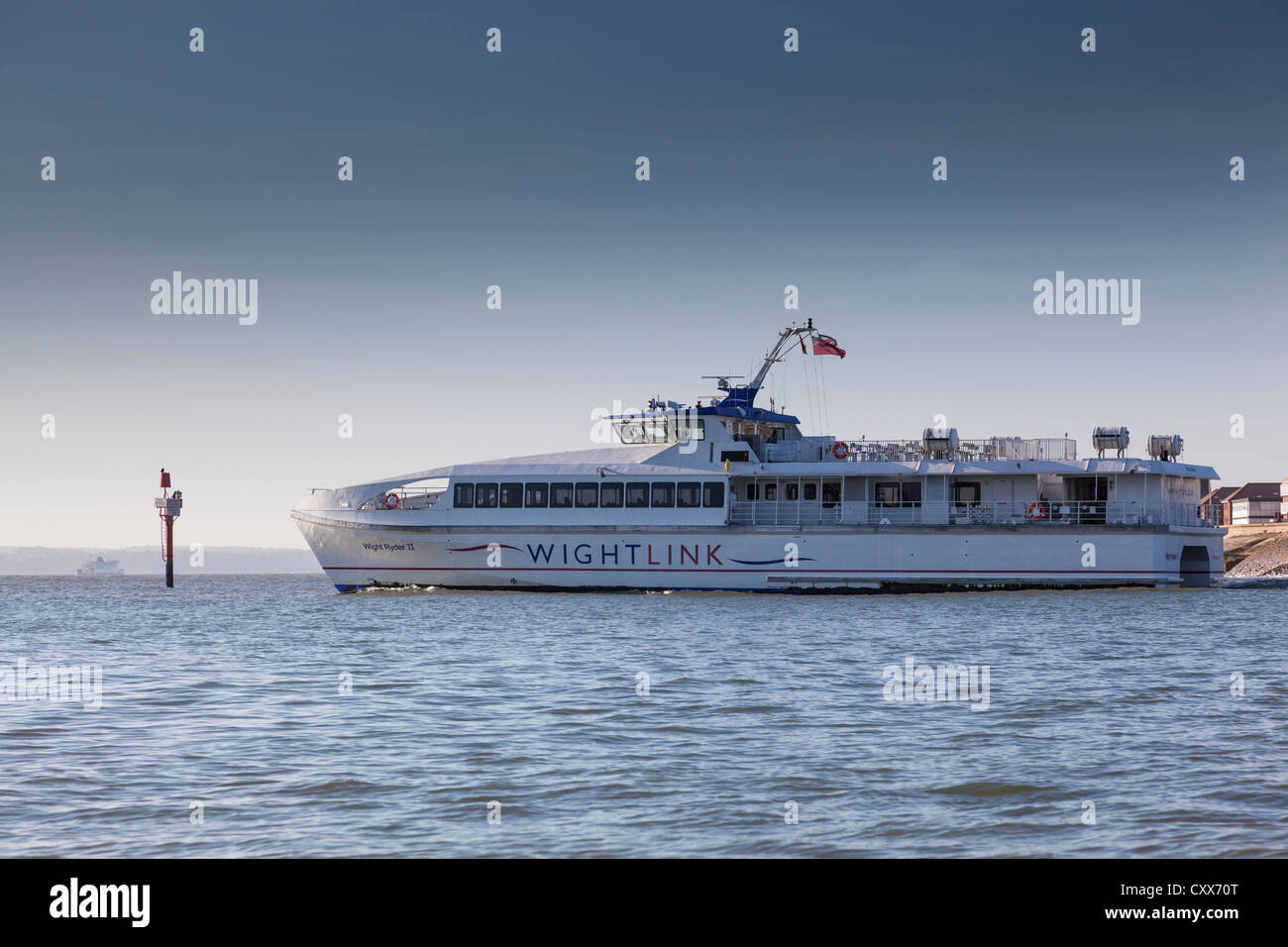 A Wightlink catamaran ferry makes its way out of Portsmouth harbour ...