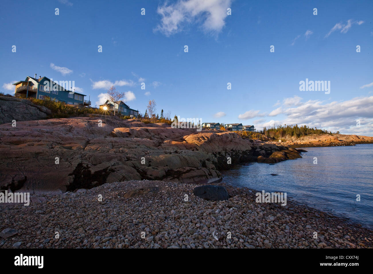 Sun sets on Condos Natakam buildings in the Essipit Innu community in ...