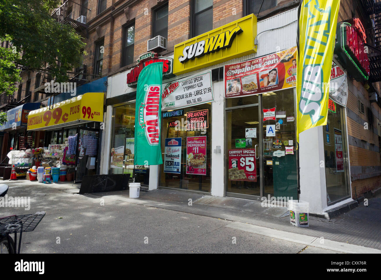 A Subway sandwich shop and a Papa John's Pizza franchises share space ...