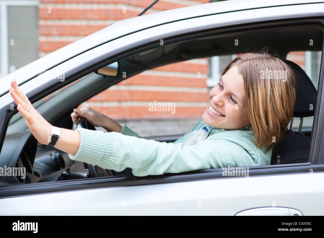 Driver waving hi-res stock photography and images - Alamy