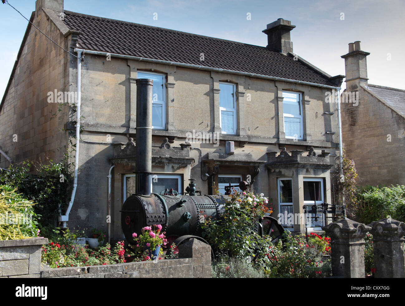 Replica steam engine in front garden of house Stock Photo - Alamy