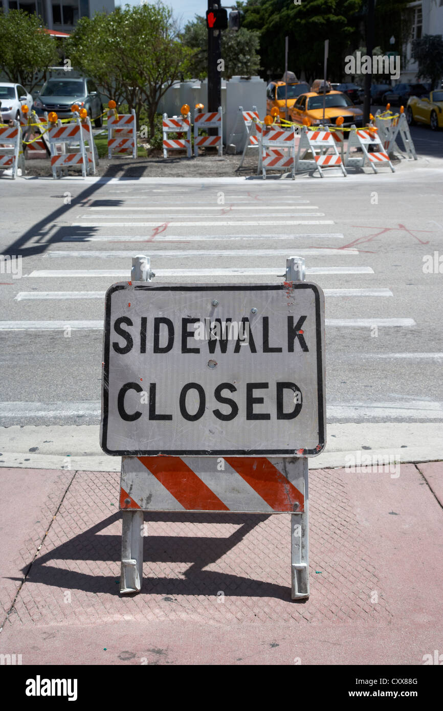 sidewalk closed sign at road pedestrian crossing miami south beach ...