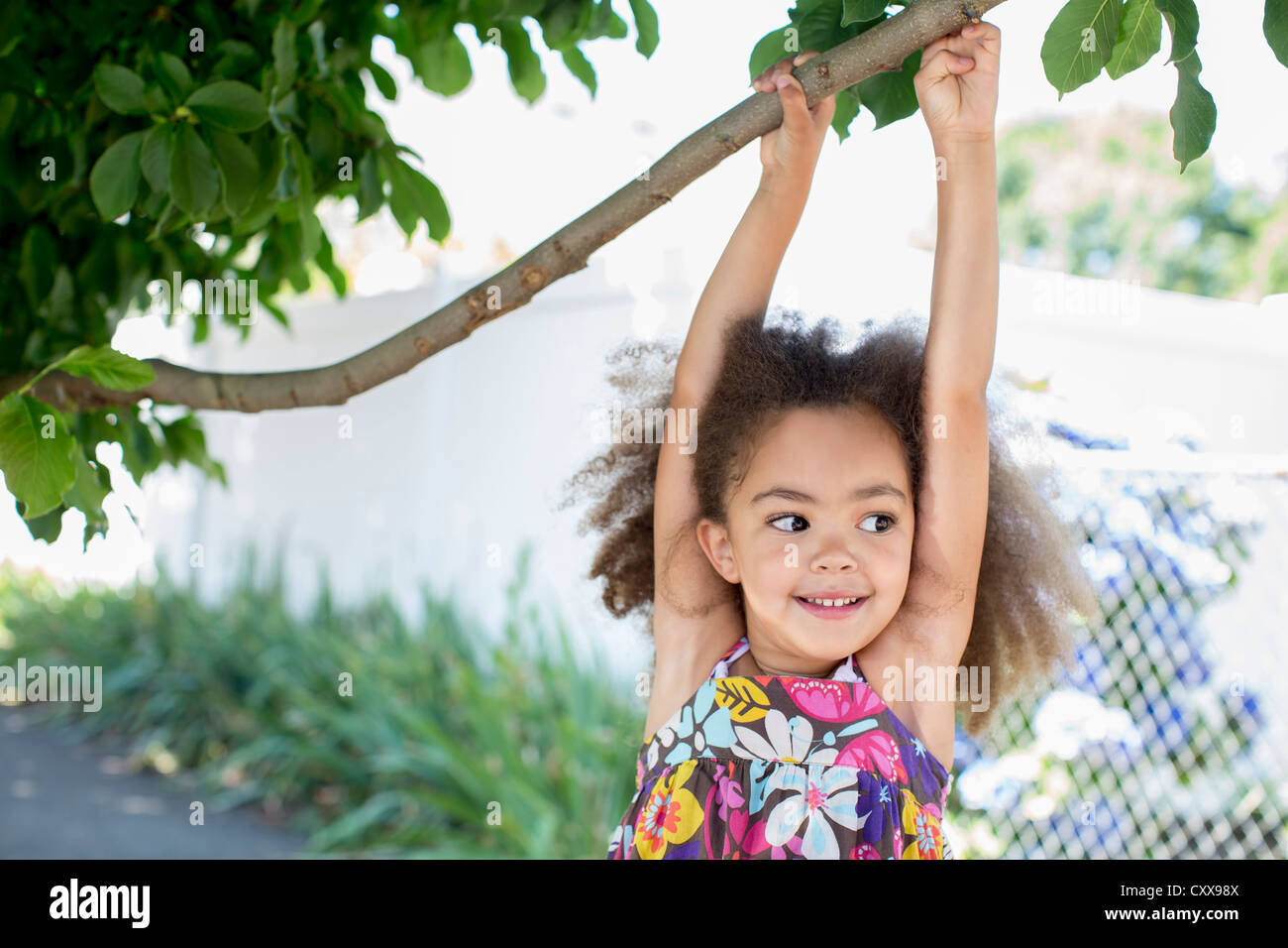 Girls hanging from tree hi-res stock photography and images - Alamy