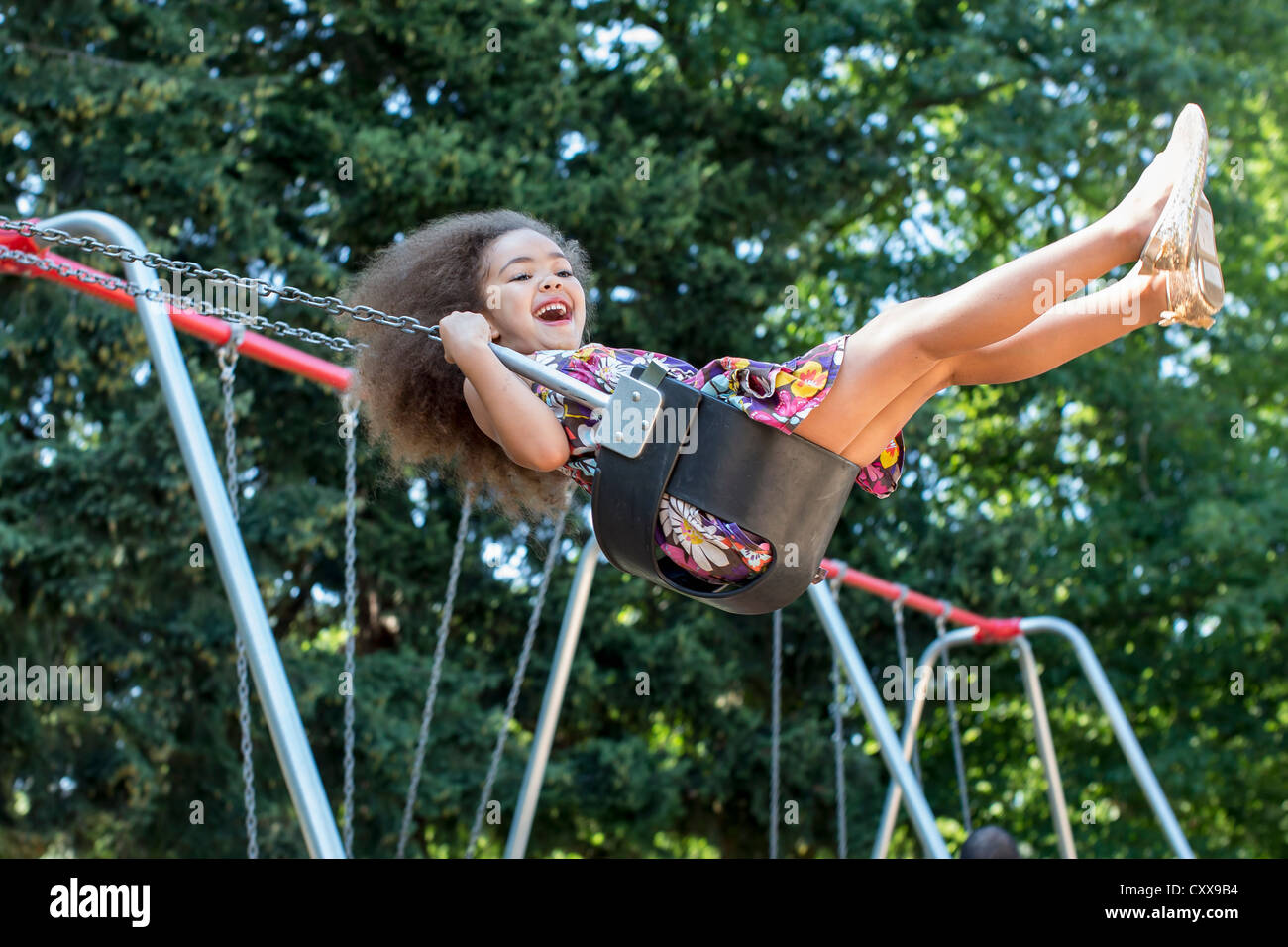 Girl swinging side view hi-res stock photography and images - Alamy