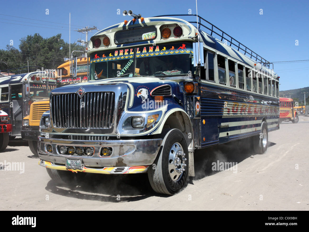 Brightly decorated local buses (chicken buses) at Antigua city bus ...