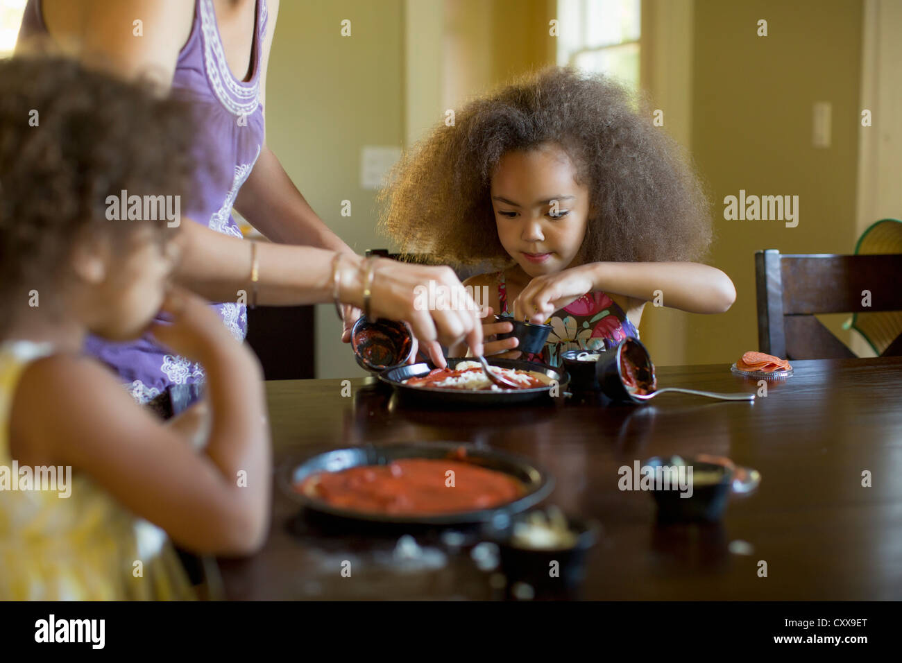 Multicultural children eating dinner hi-res stock photography and ...