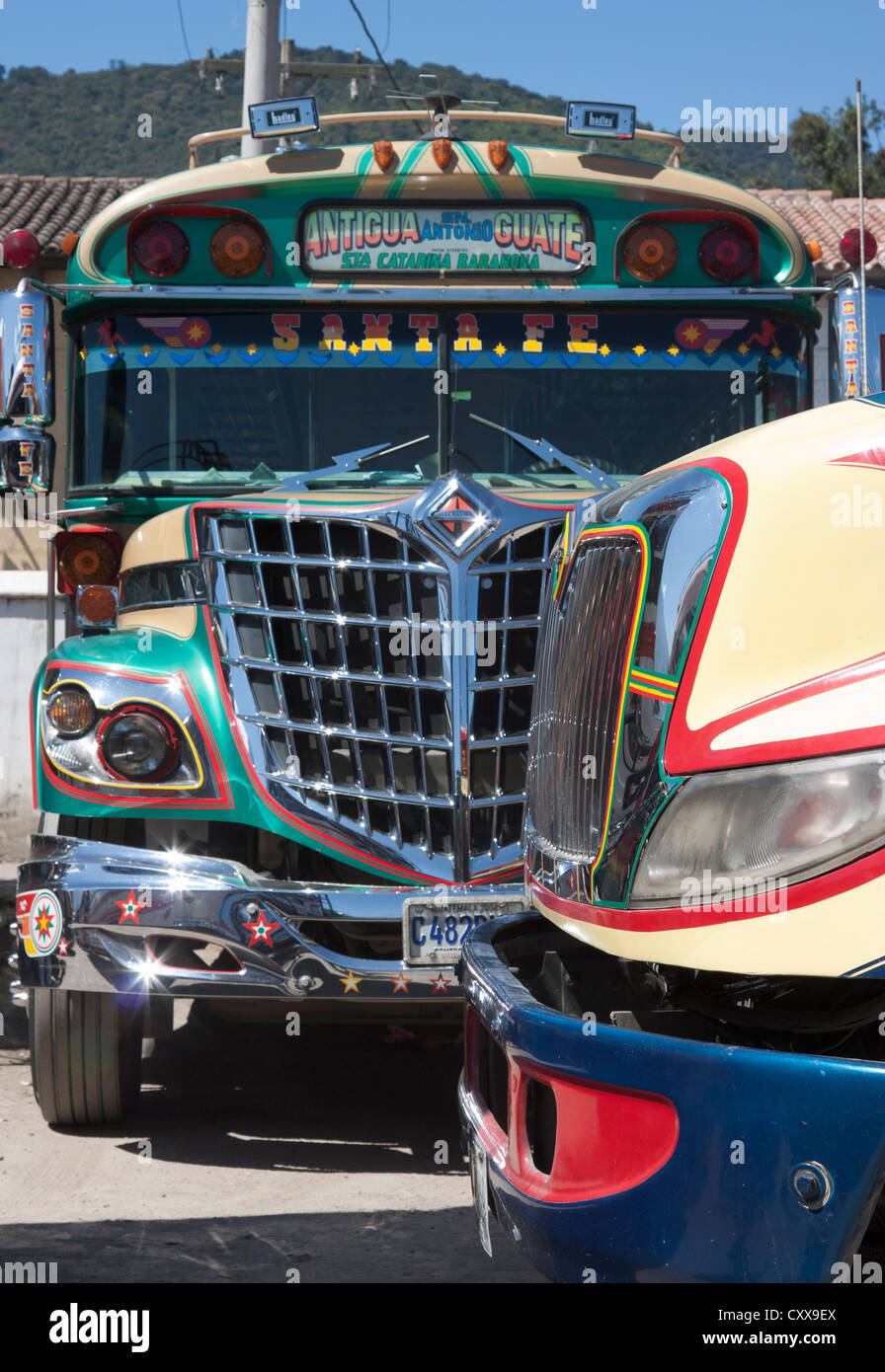 Brightly decorated local buses (chicken buses) at Antigua city bus ...