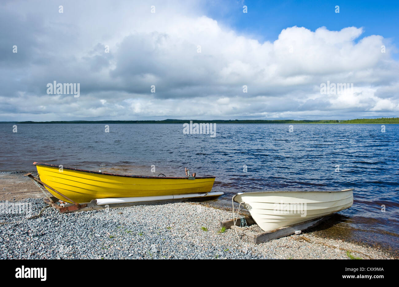 Two small boats on the shore in Västerbotten, northern Sweden Stock ...