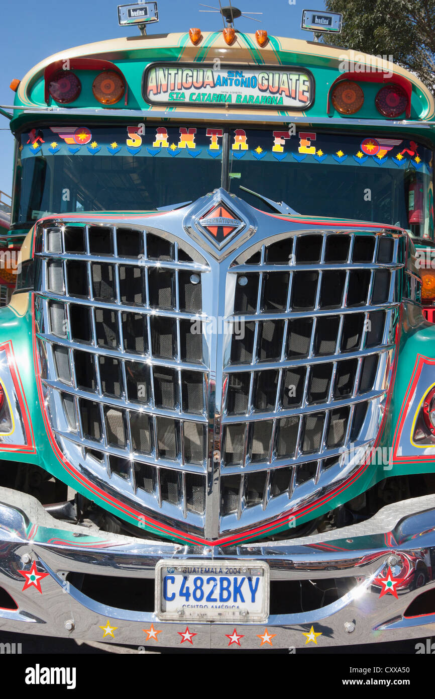 Brightly decorated local buses (chicken buses) at Antigua city bus ...