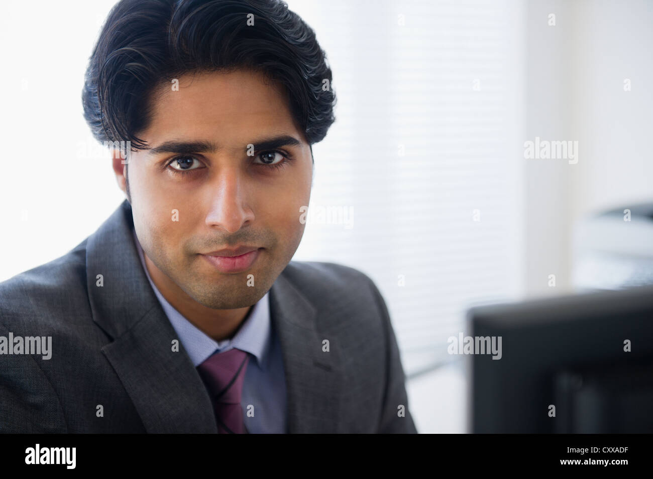 Serious mixed race businessman Stock Photo - Alamy