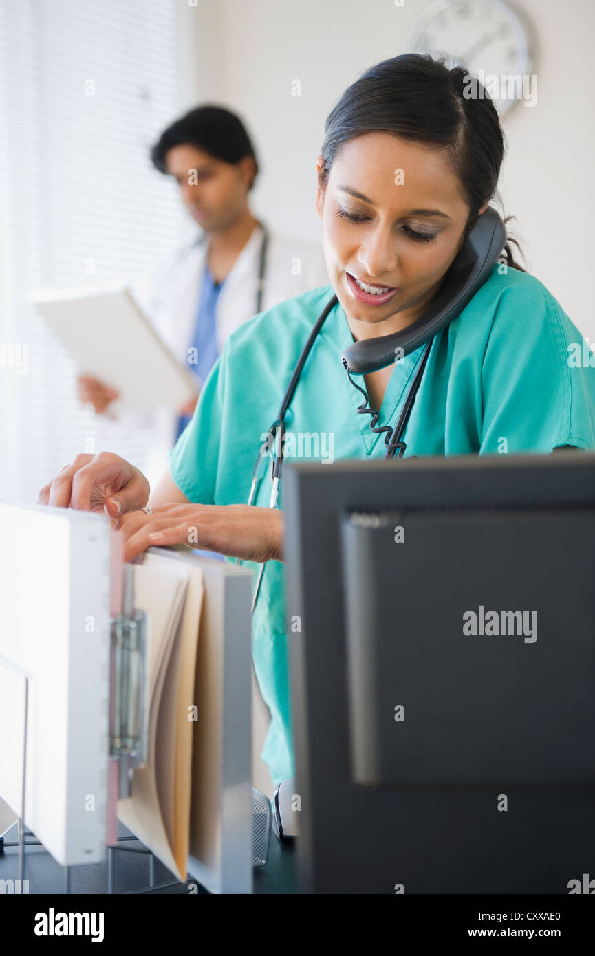 Indian man talking nurse hi-res stock photography and images - Alamy