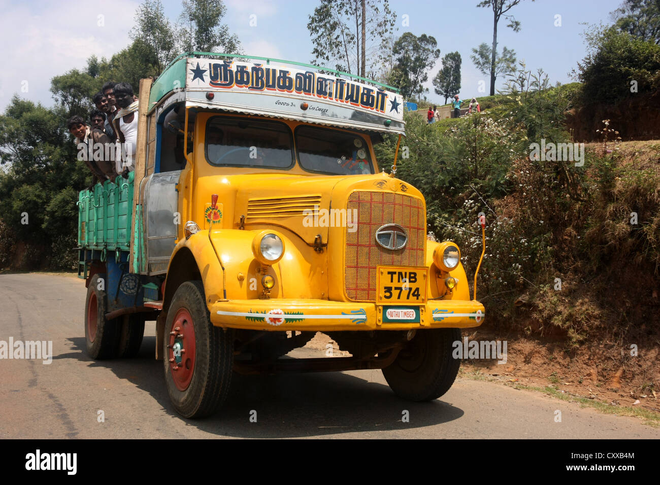 Vintage Indian Tata 1210 SE truck carrying tea plantation workers near ...