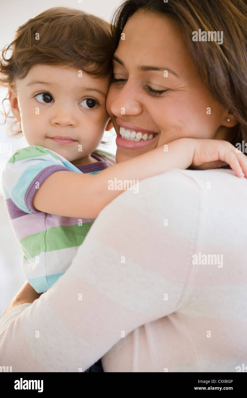 Mother hugging son Stock Photo - Alamy