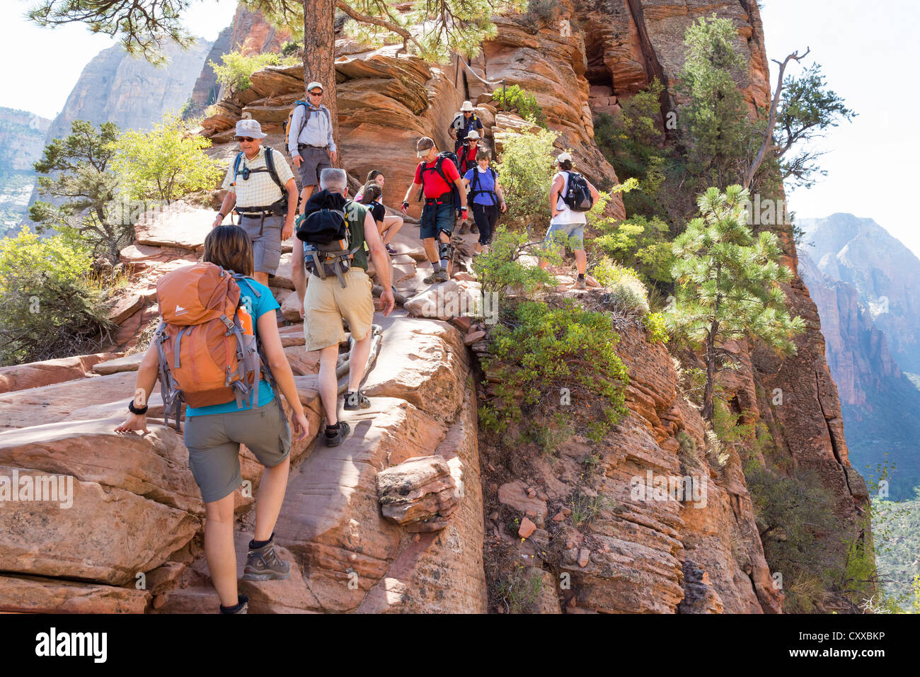 People hiking a strenuous Angel's Landing trail at Zion National Park ...