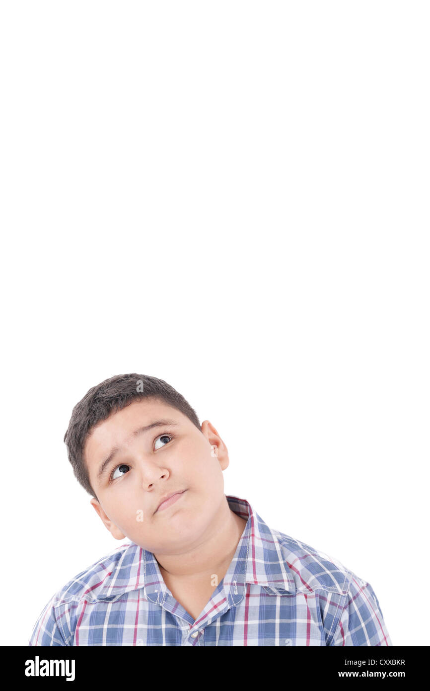 Cute boy looking up at copy space for your text Stock Photo - Alamy