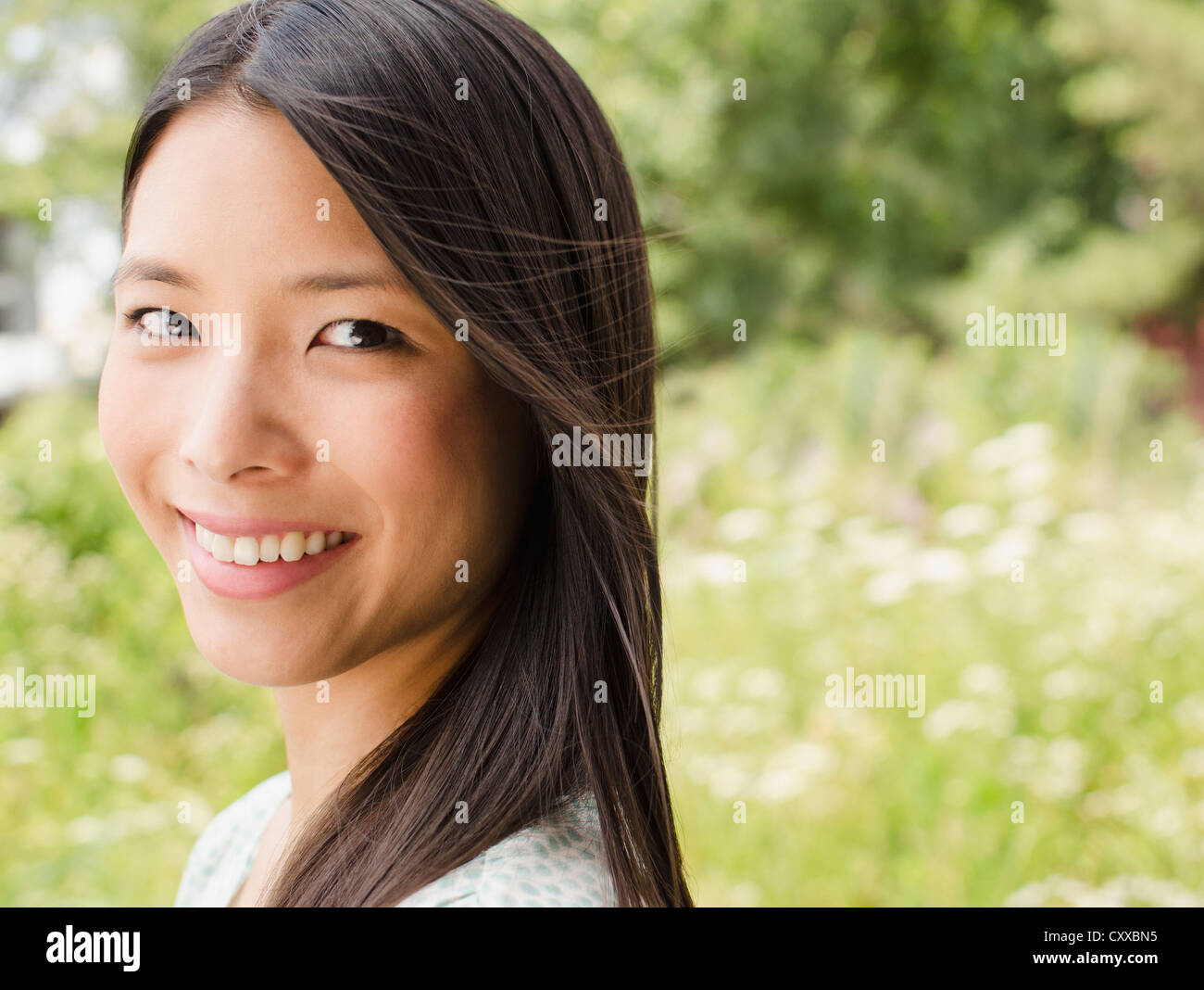 Smiling Asian woman Stock Photo - Alamy