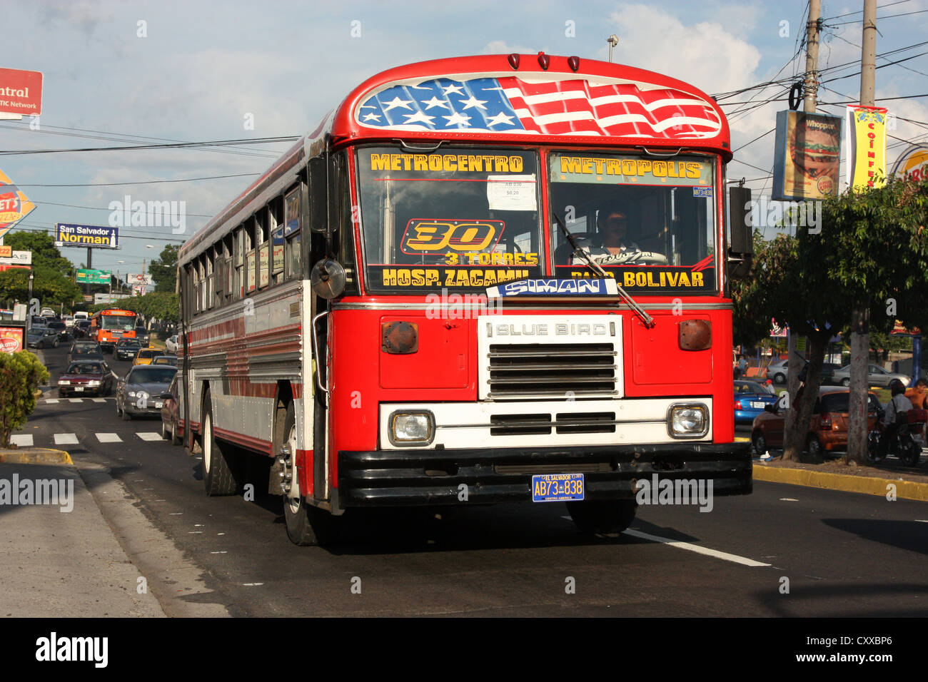 Local commuter bus on the city streets of San Salvador, El Salvador ...