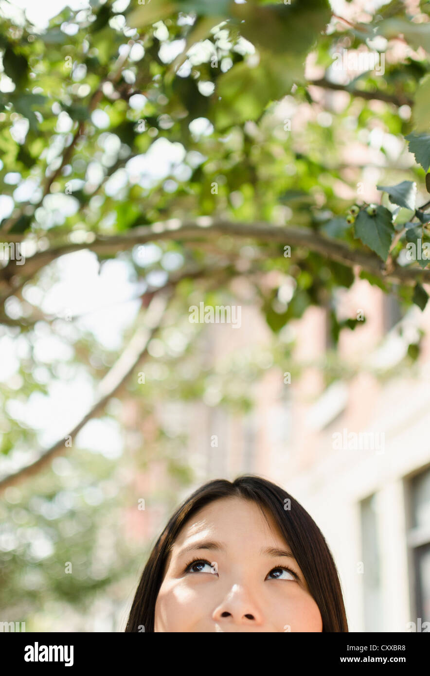 Asian woman looking up Stock Photo - Alamy