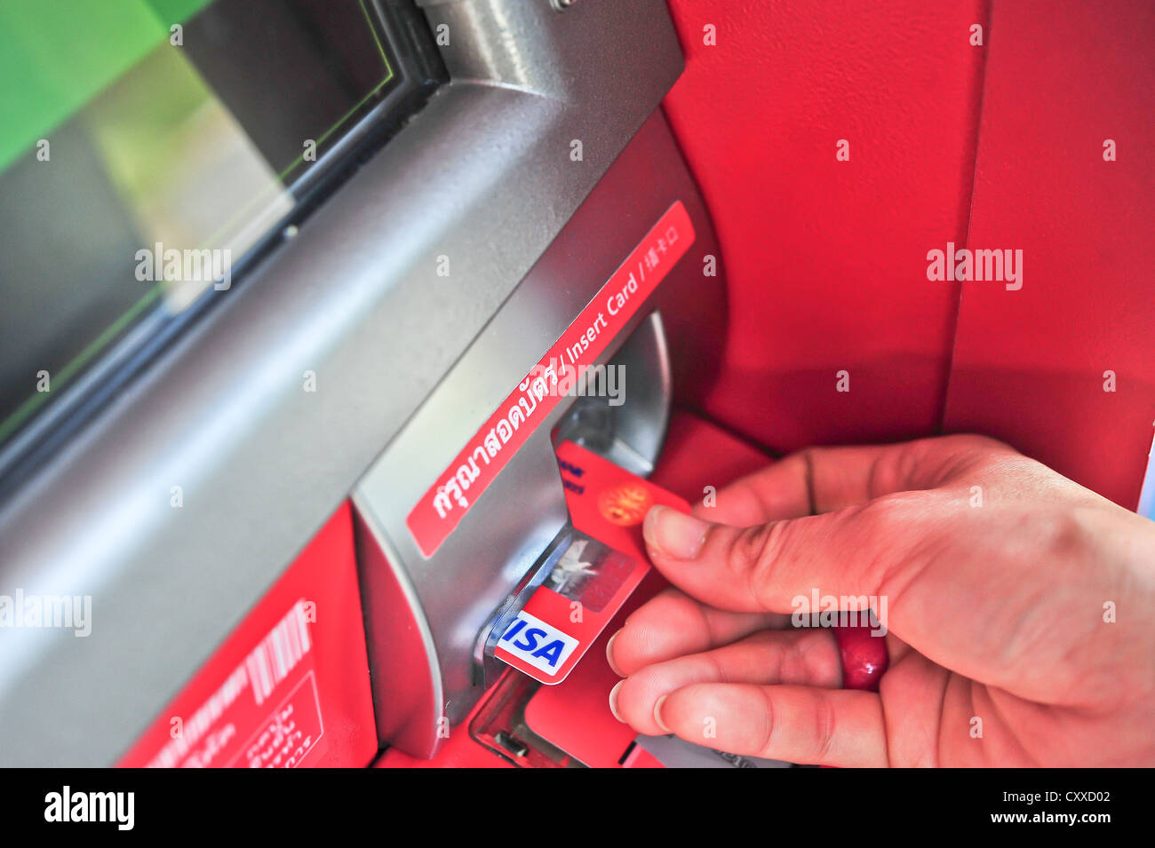 Female hand inserts a plastic card in the ATM Stock Photo - Alamy