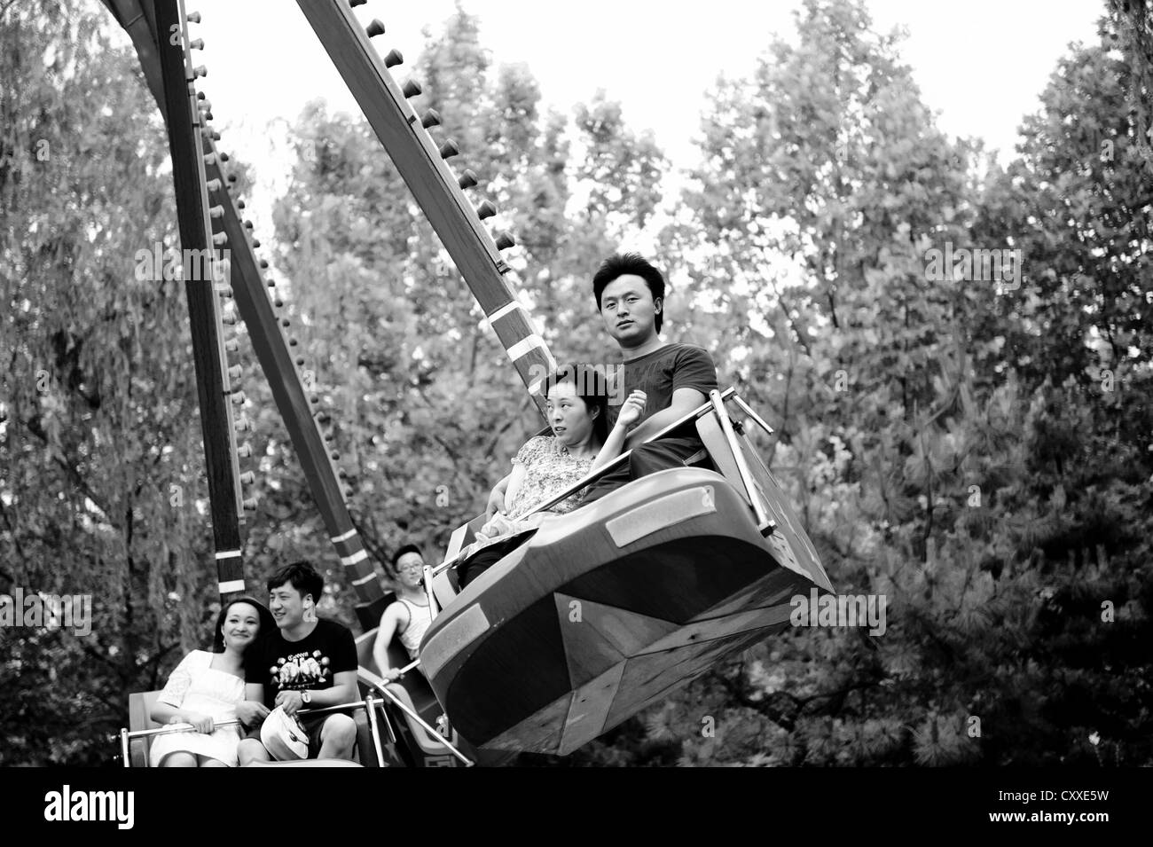 People in park ride Black and White Stock Photos & Images - Alamy