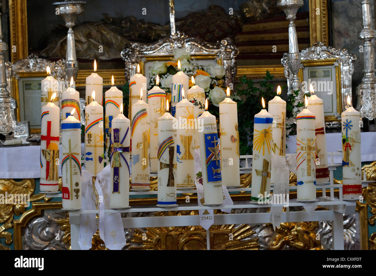Lit first communion candles, Bavaria Stock Photo - Alamy