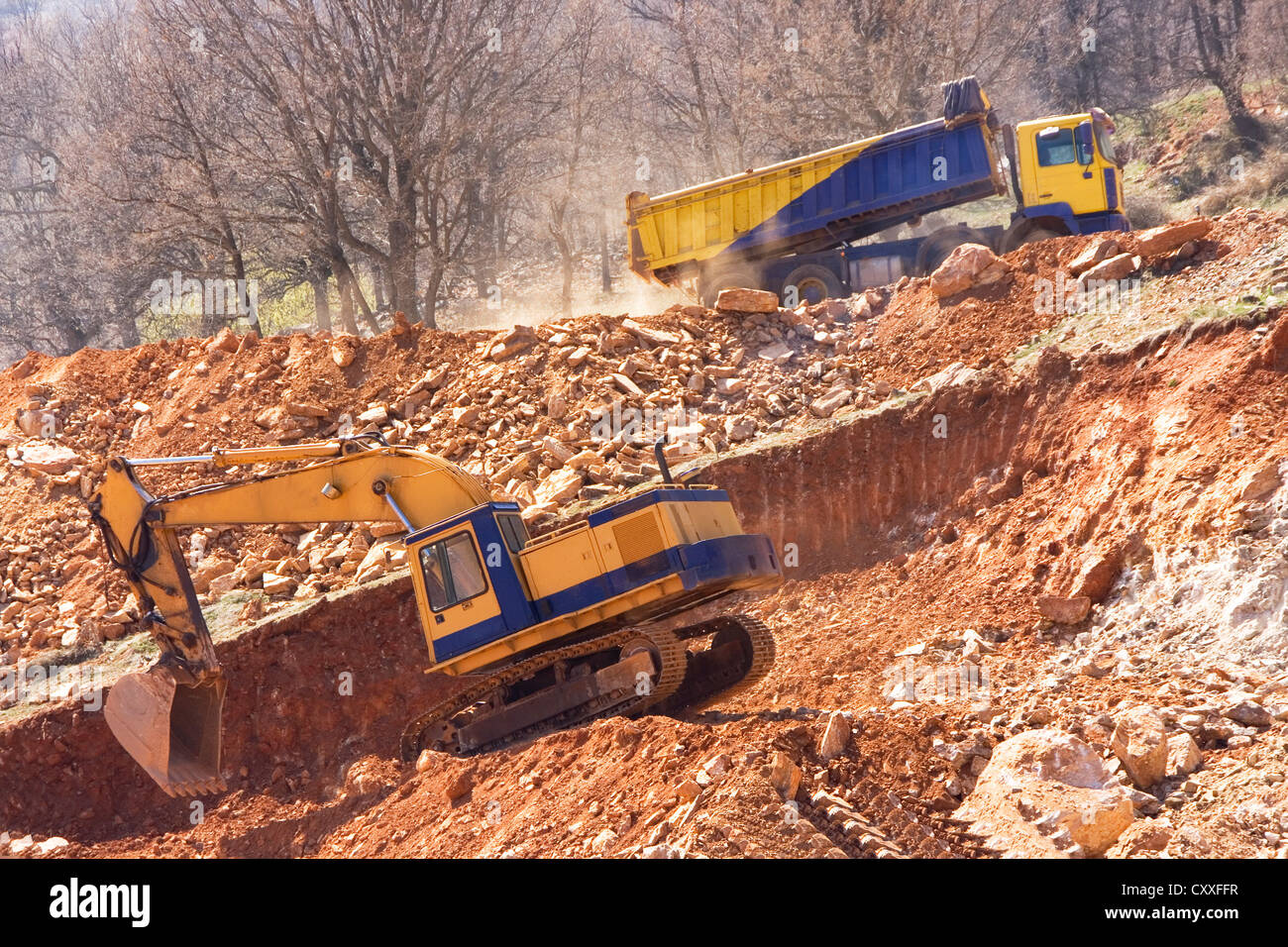 Heavy duty construction equipment by work site Stock Photo - Alamy