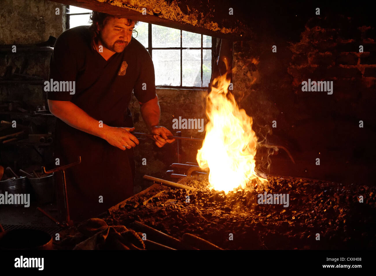 Forgemaster Frank Wagenhofer at work, blacksmith, historic forge at ...