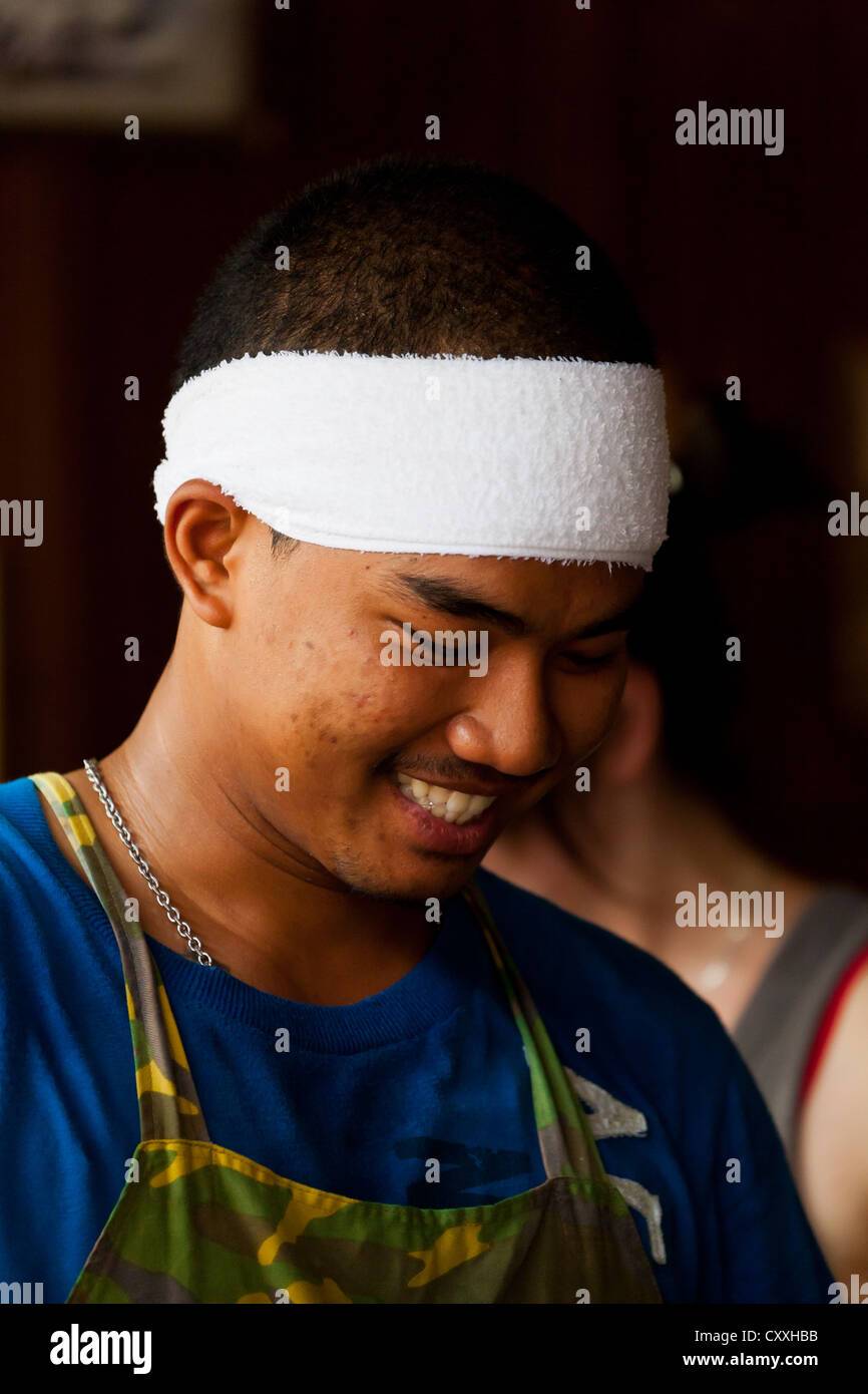 Thai Cook with a white Headband in Bangkok, Thailand Stock Photo - Alamy