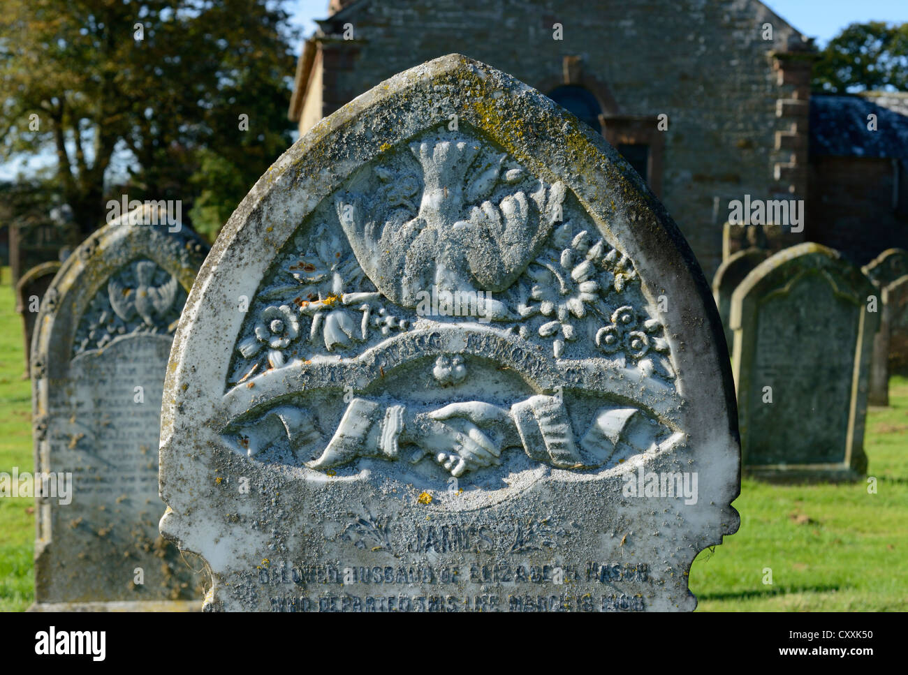 Gravestone with dove and handshake design. All Saints Church, Raughton ...