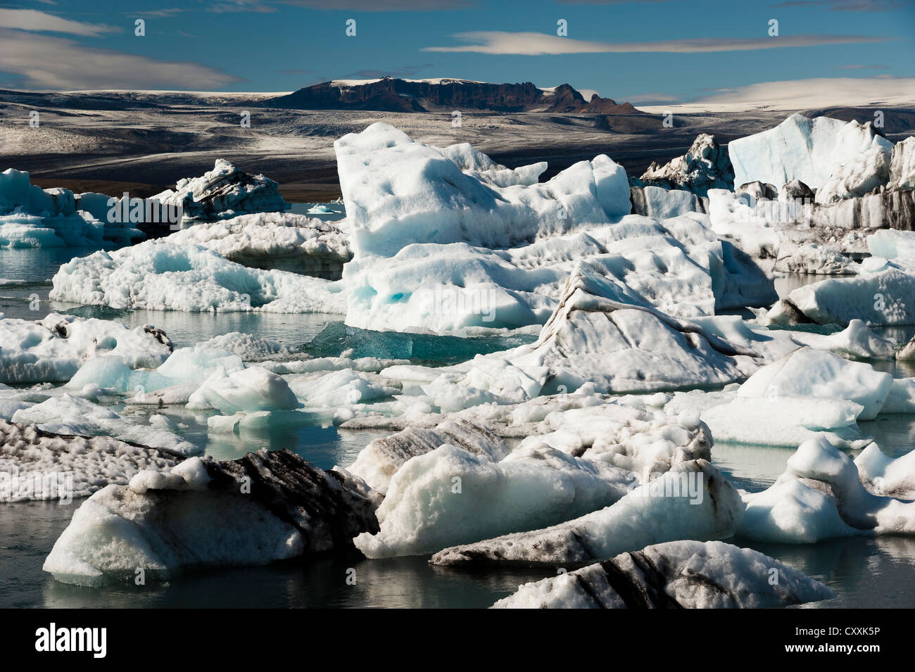 Partly black ash-coloured icebergs, glacier lagoon of Joekulsárlón ...