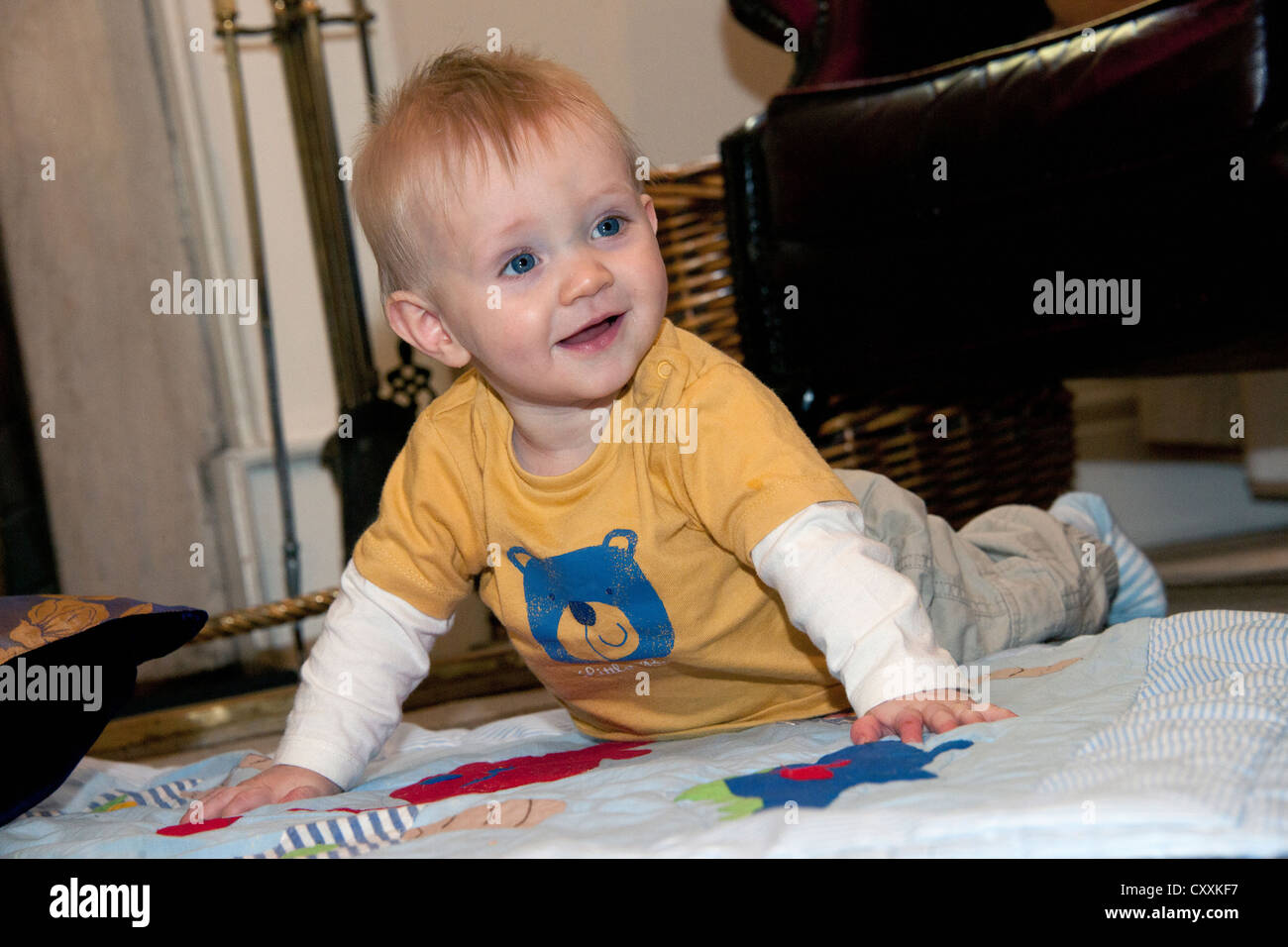 Happy toddler on a play mat Stock Photo - Alamy