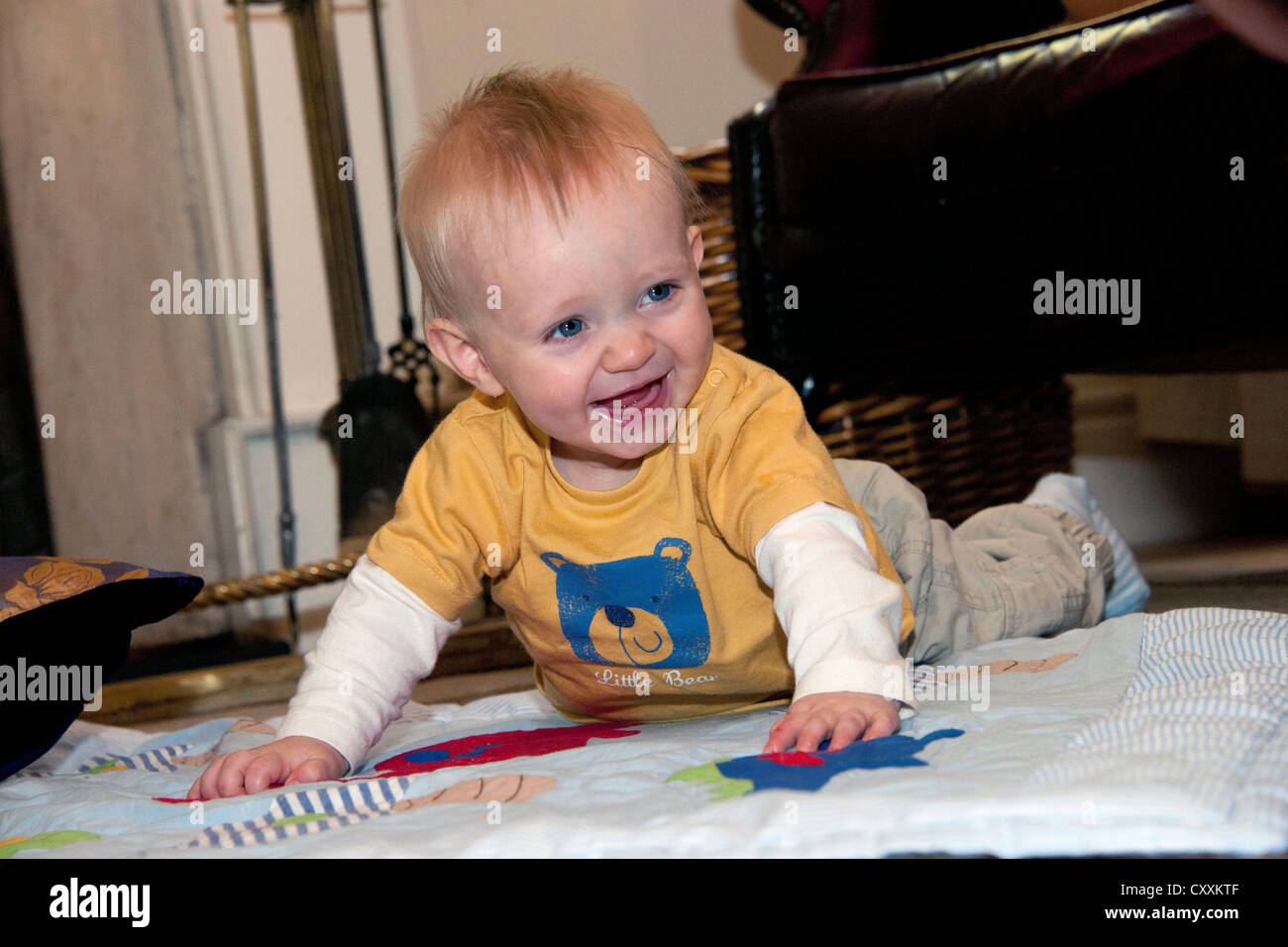 Happy toddler on a play mat Stock Photo - Alamy