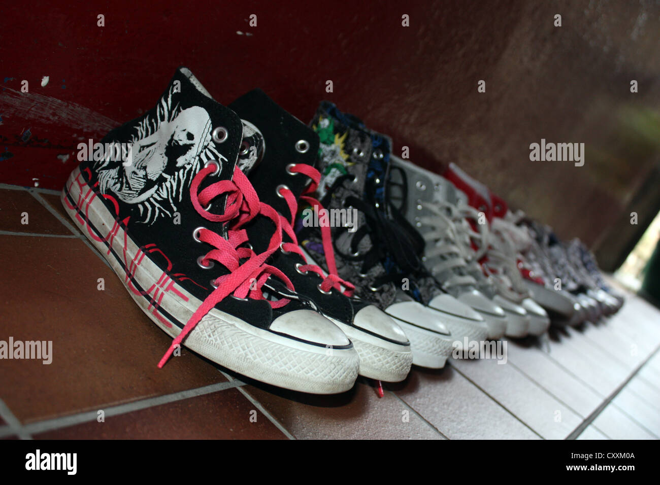 A row of similar trainers all in different colours and styles Stock ...
