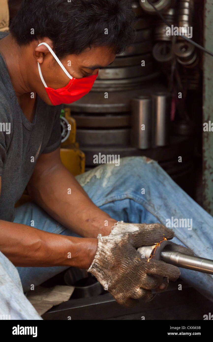 Mechanic working on the Street in Bangkok, Thailand Stock Photo - Alamy