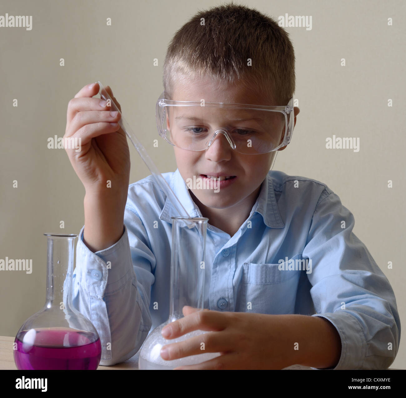 child is doing experiments in chemistry Stock Photo - Alamy
