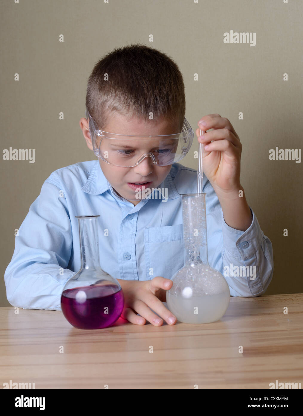 child is doing experiments in chemistry Stock Photo - Alamy