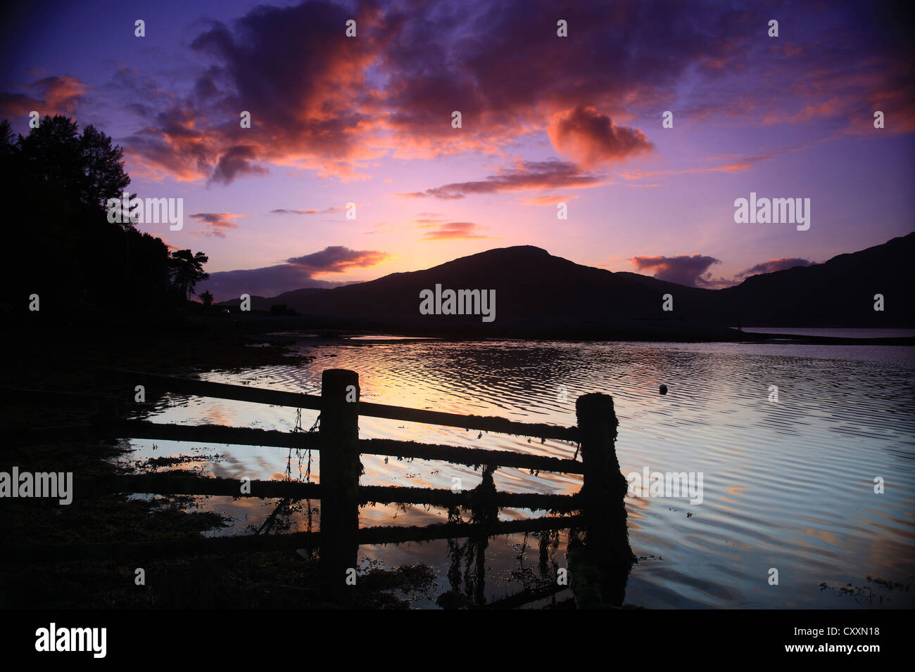 A beautiful sunset over the Isle of Skye from the mainland at Glenelg ...