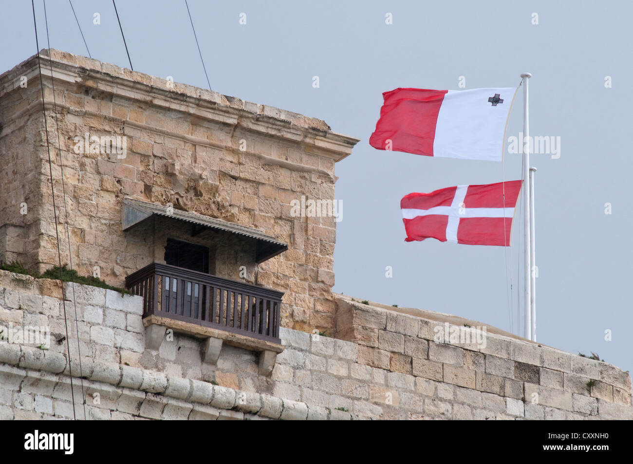 Maltese flags fly above Fort St. Angelo, Vittoriosa, Malta Stock Photo ...