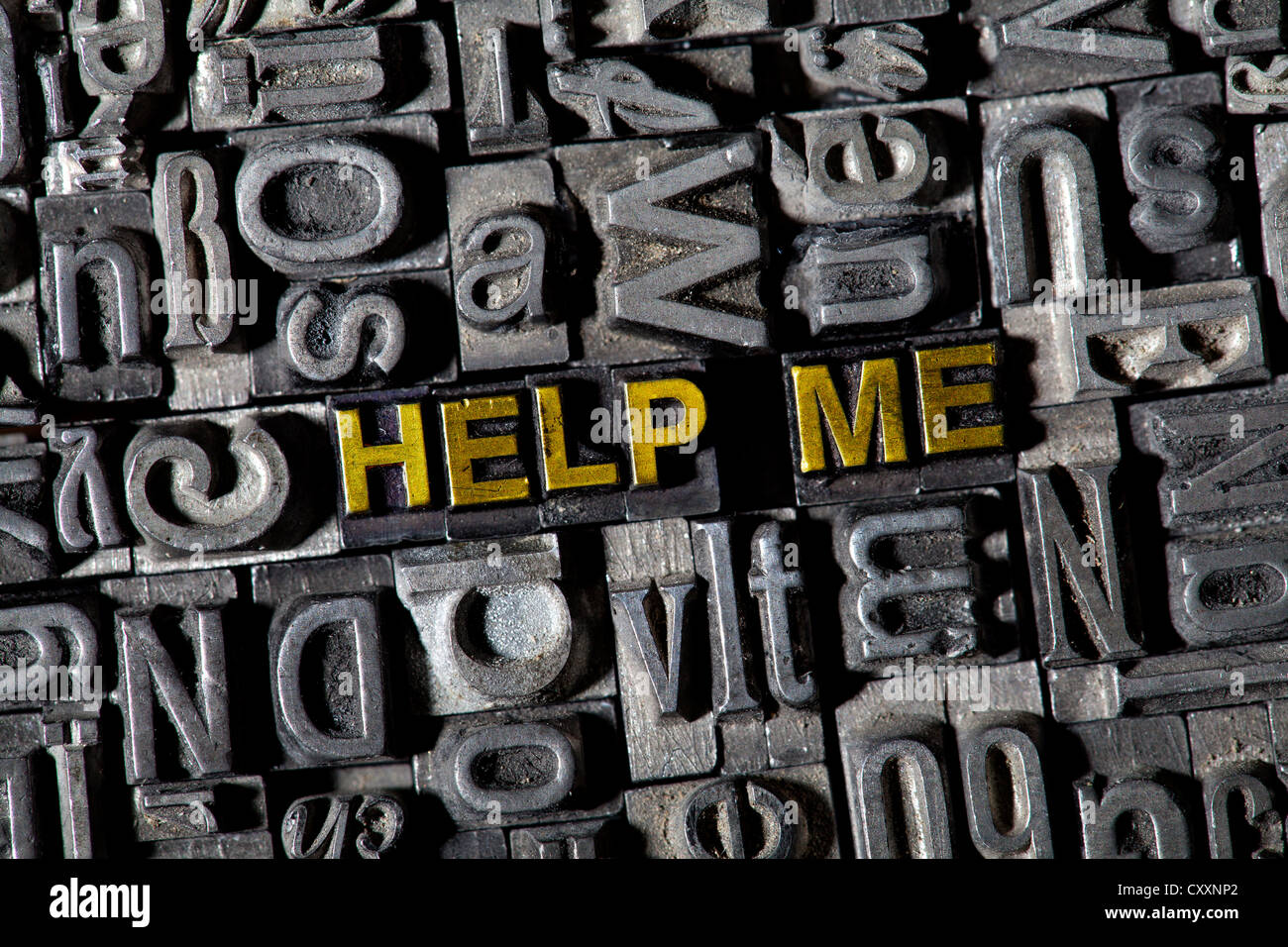 Old lead letters forming the words "HELP ME Stock Photo - Alamy