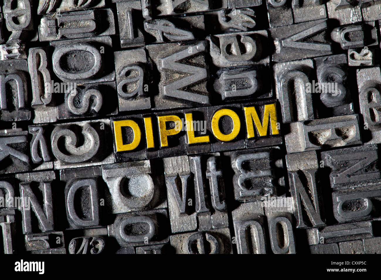 Old lead letters forming the word "DIPLOM", German for "Diploma Stock ...