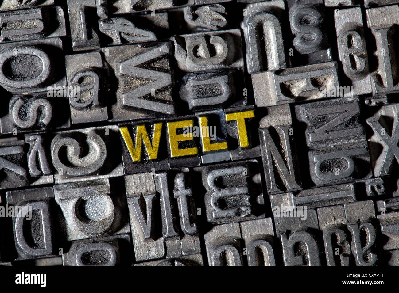 Old lead letters forming the word "WELT", German for "world Stock Photo ...