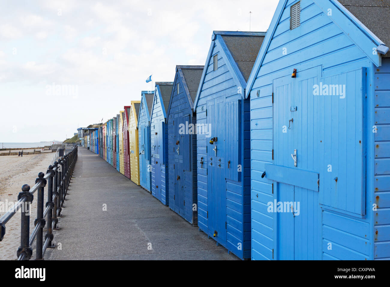 North Norfolk Mundesley multi coloured beach huts on the sea wall Stock ...
