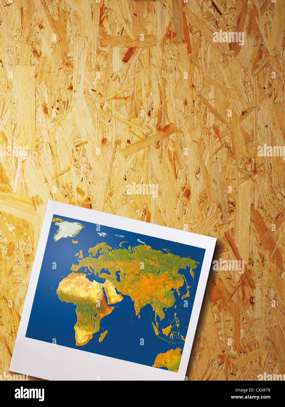 Polaroid photo with map of Europe, Asia, Africa, hanging on a wood ...