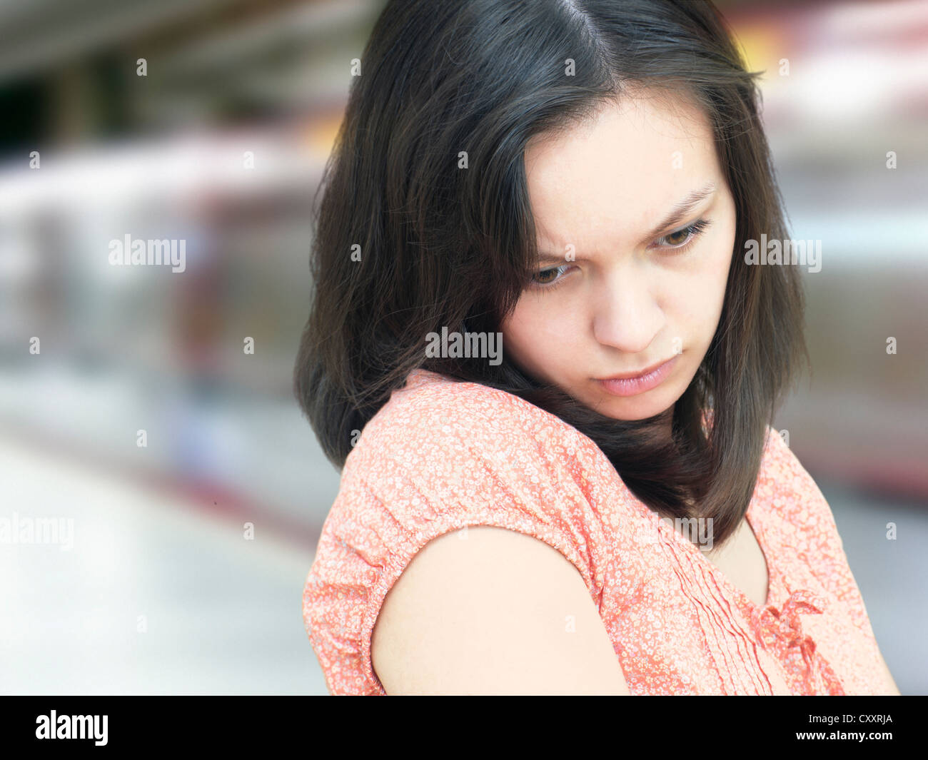 Sad young woman, a subway at the back Stock Photo - Alamy