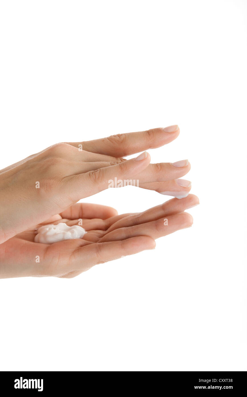 Female hands with white cream on white background Stock Photo - Alamy